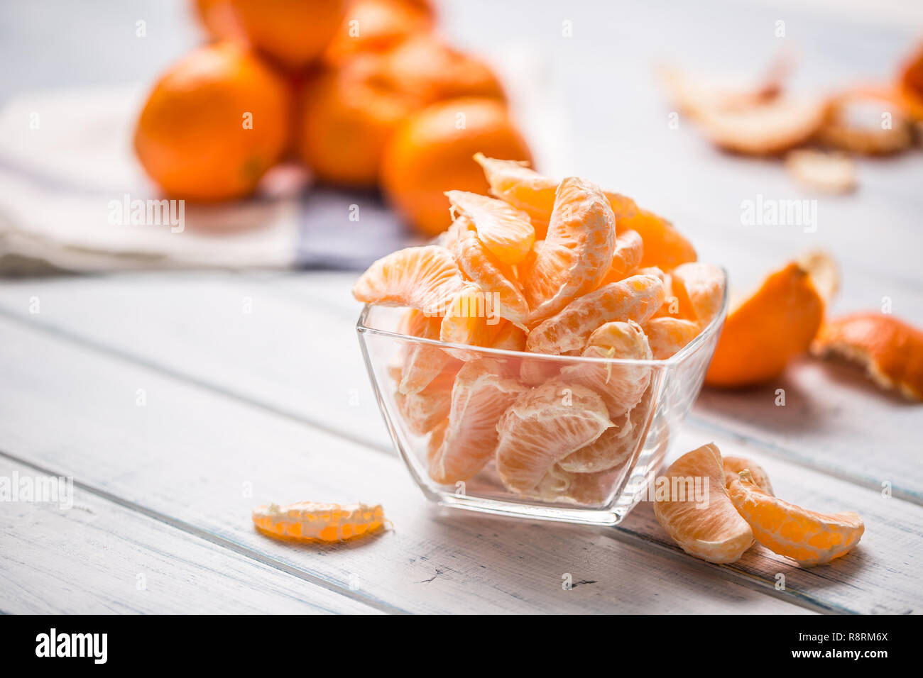 Fresh pieces of tangerines mandarin on the plate or in a bowl Stock ...