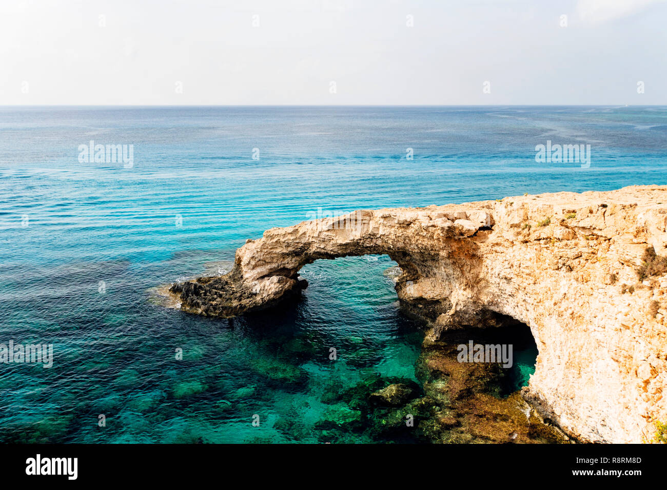 Bridge of Lovers rock formation on the rocky shore of the Mediterranean ...
