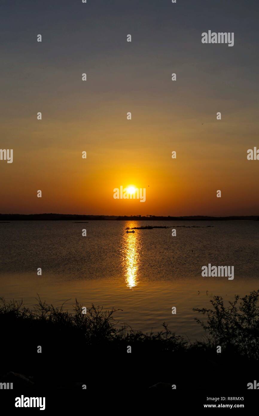 Beautiful sunset over lake with fishing boat, Zambia Stock Photo - Alamy