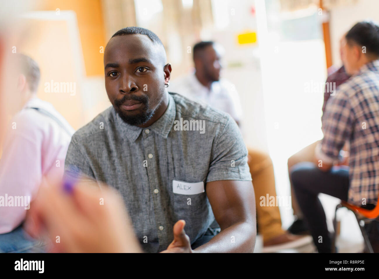 Group of men listening hi-res stock photography and images - Alamy