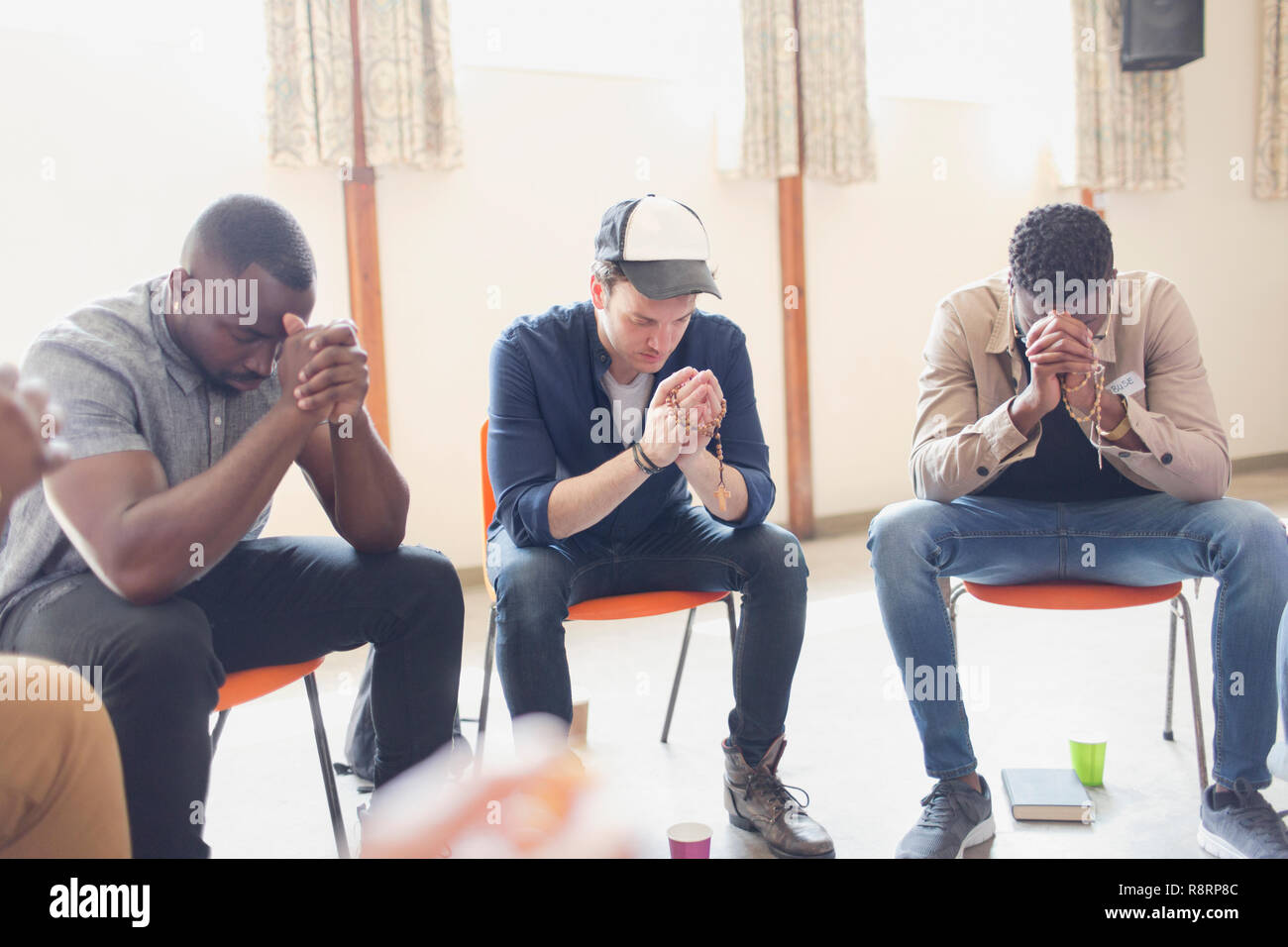 Group praying hands hi-res stock photography and images - Alamy