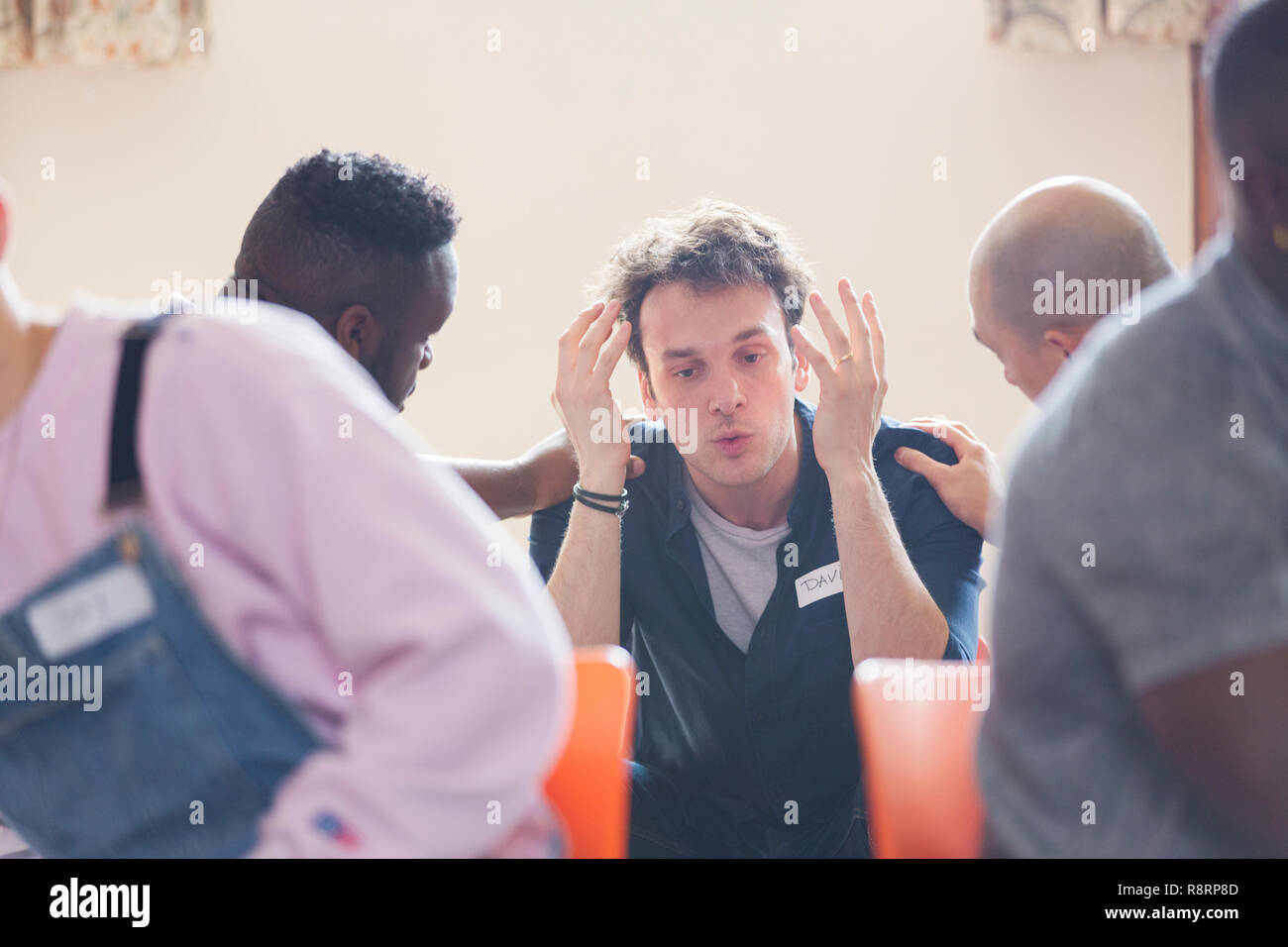 Community helping comforting hi-res stock photography and images - Alamy
