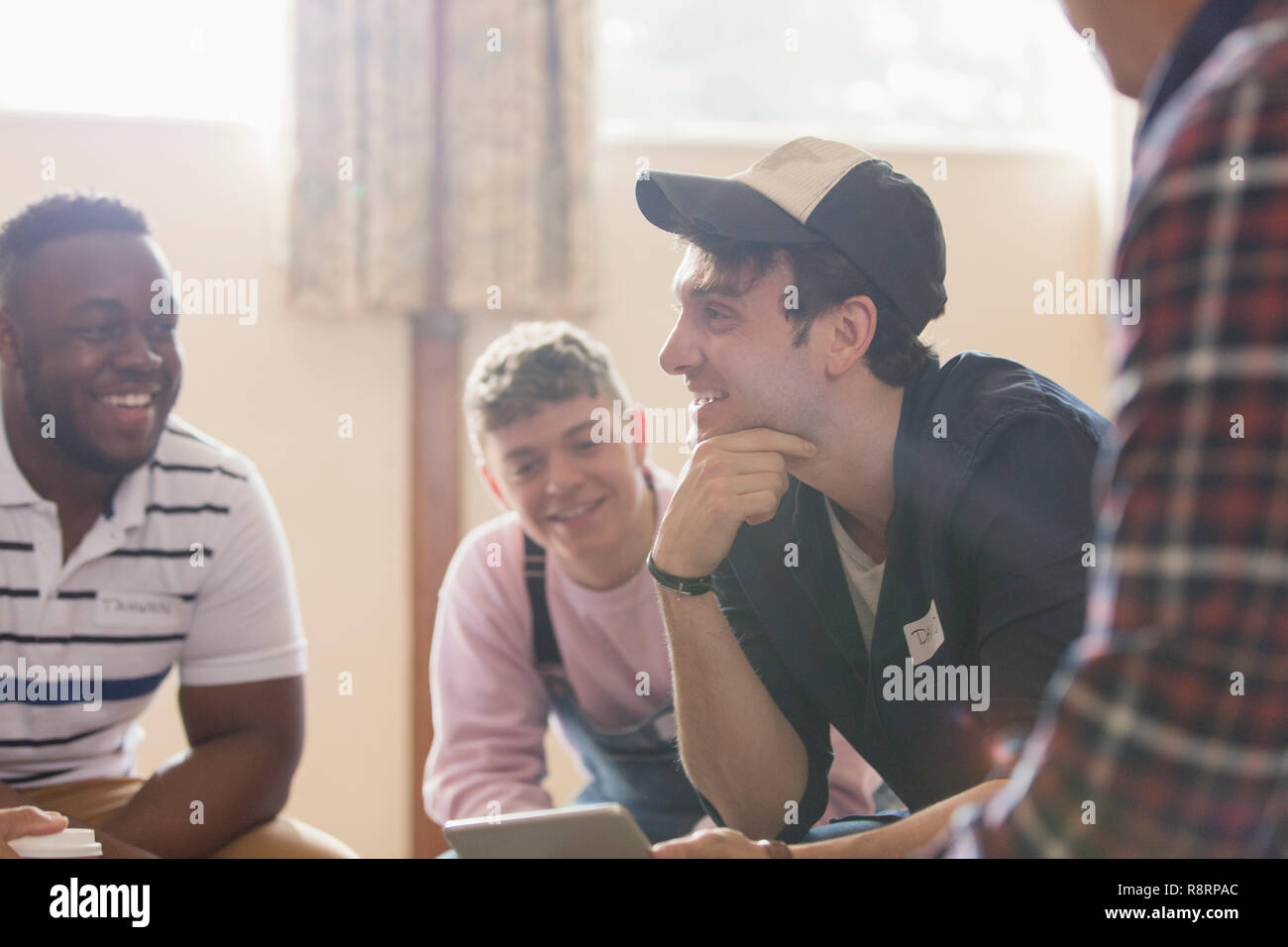 Men talking in group therapy Stock Photo - Alamy