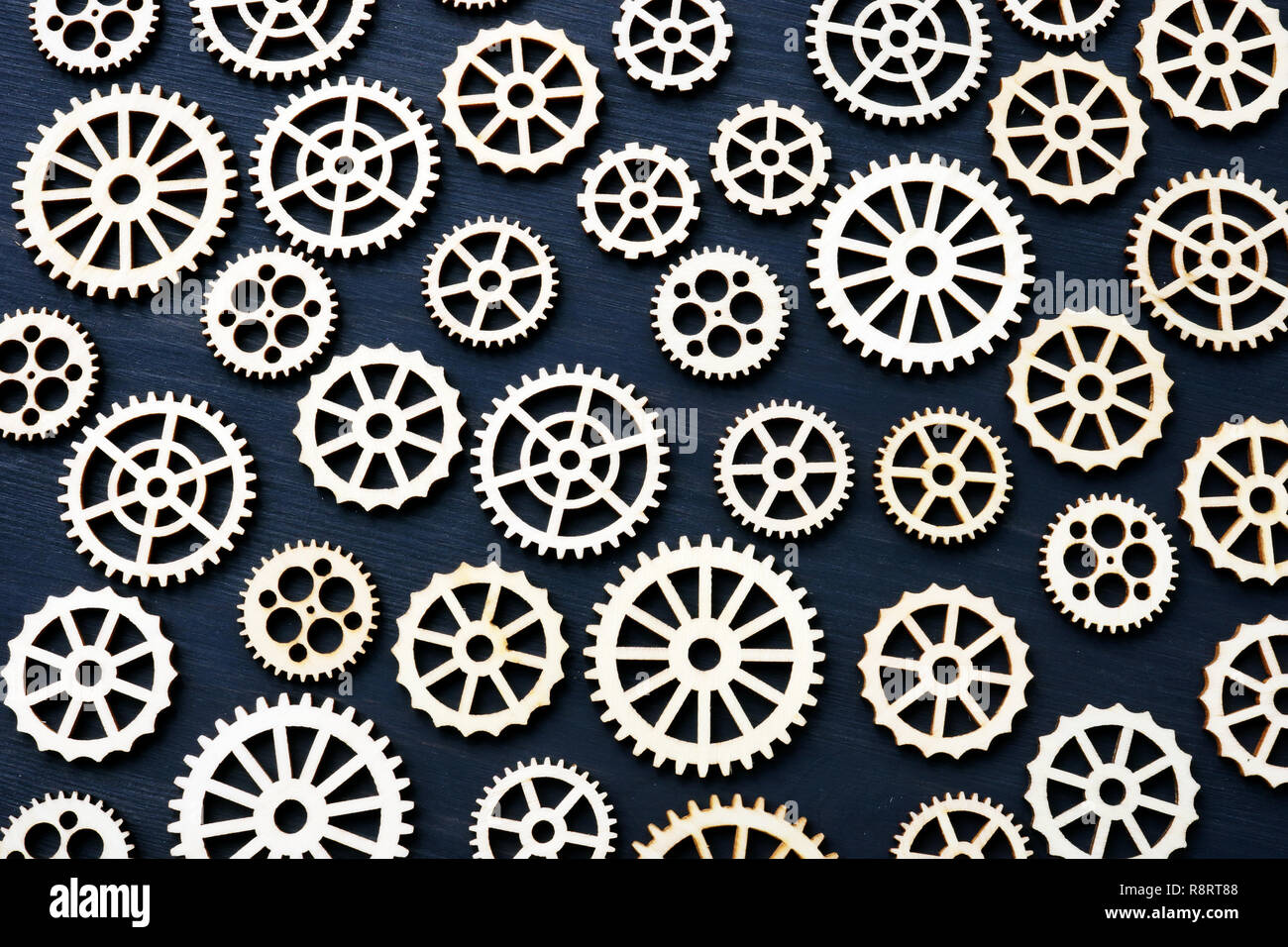 Technical Background from gear wheels on a dark wood Stock Photo - Alamy