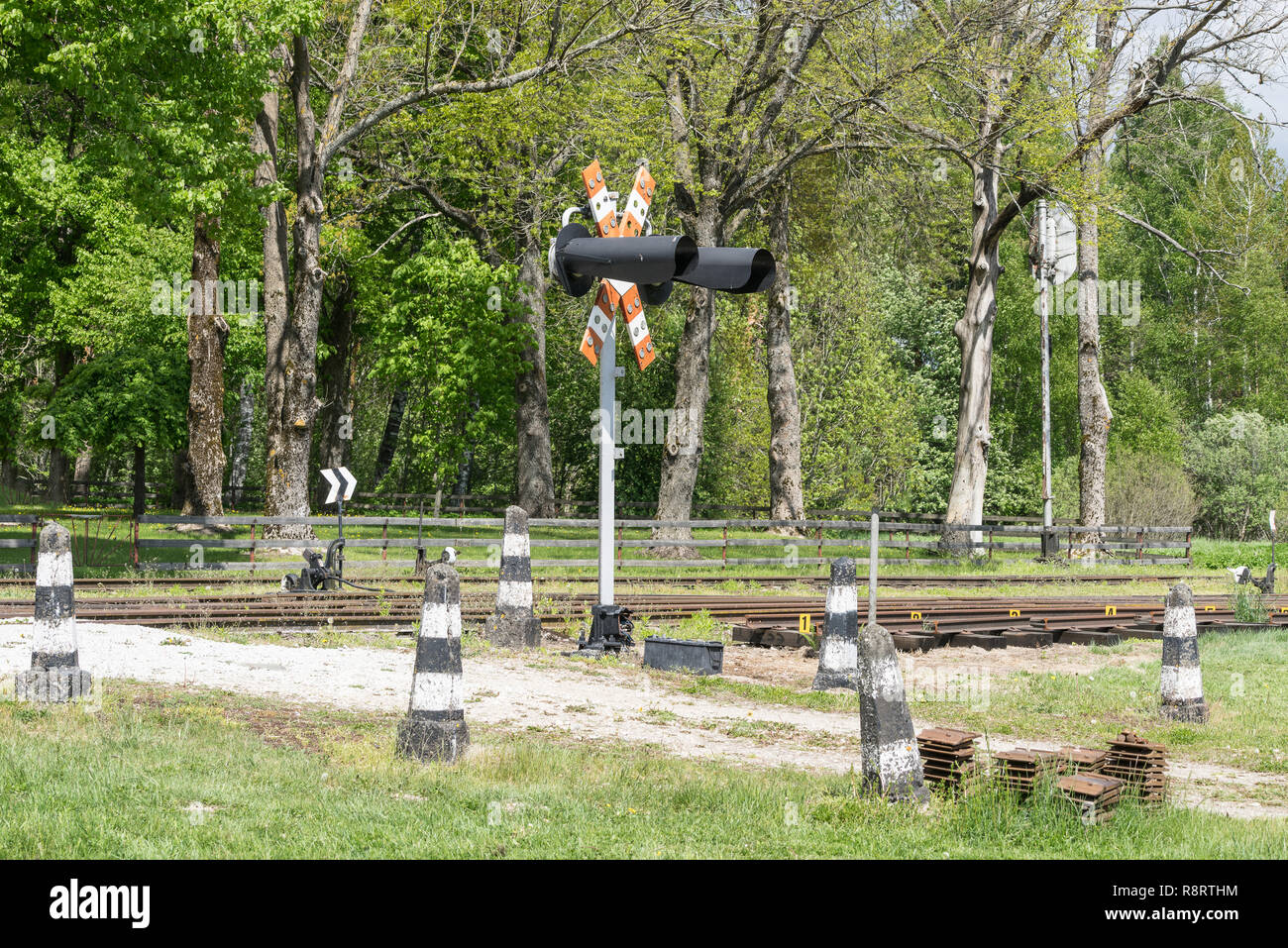 Railroad tracks stretches and green grass and trees. Railway road ...