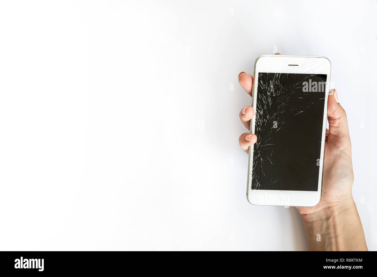 Smartphone with broken screen in hand on white background Stock Photo ...