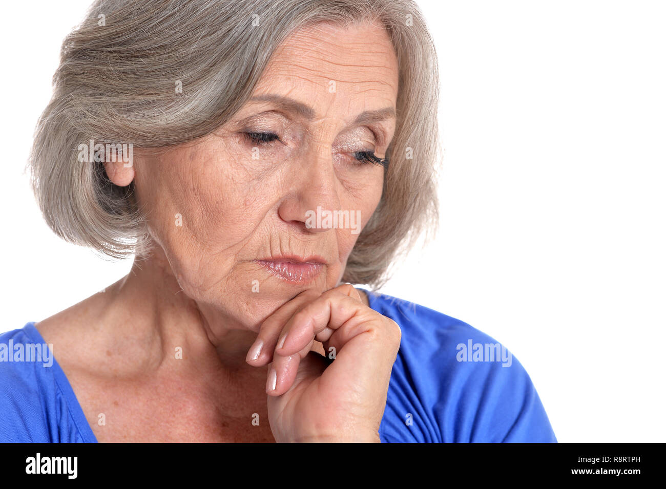 Sad senior woman isolated on white background Stock Photo - Alamy