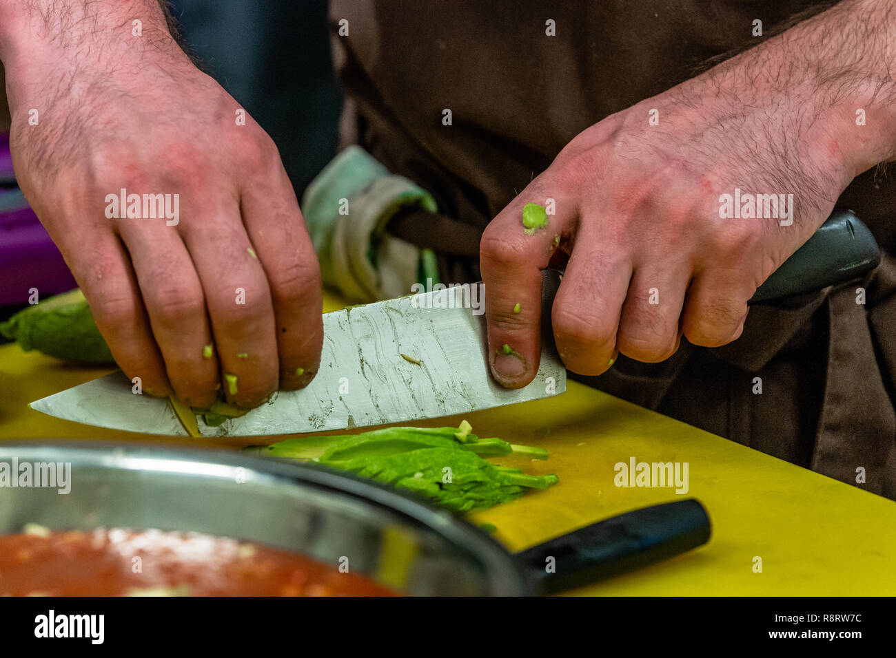 Male Chef Slicing Avocado for Wedding Meal - Kitchen Set with Isolated ...