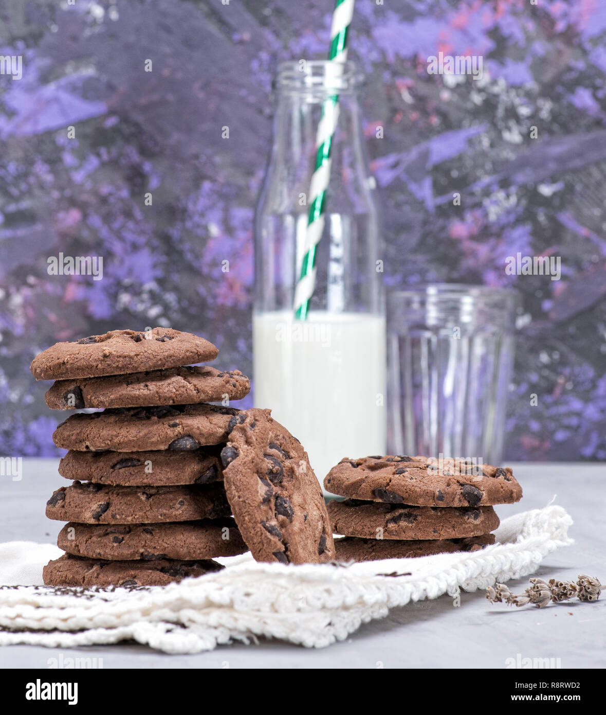 stack of round chocolate cookies and milk, close up Stock Photo - Alamy