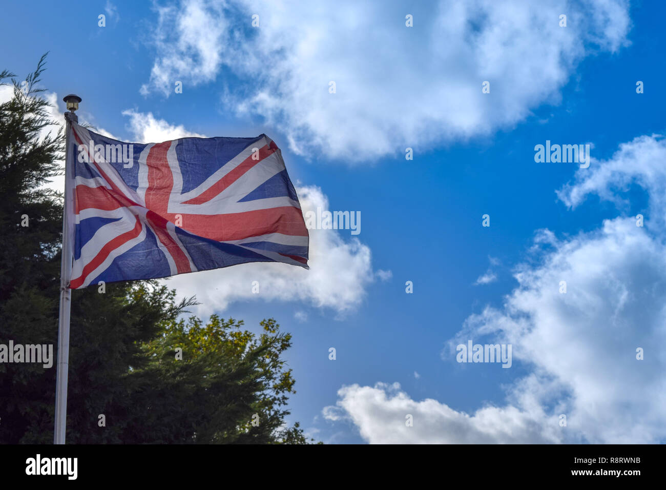 Union Jack flag on a windy summers day Stock Photo - Alamy
