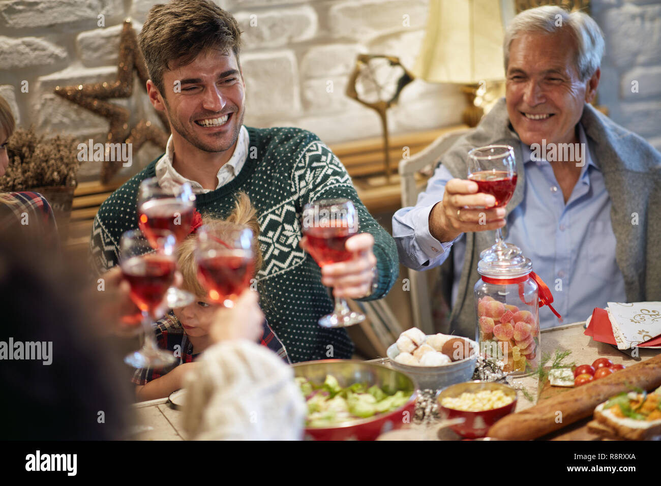 Merry Christmas! Happy family toasts together on Christmas dinner Stock ...