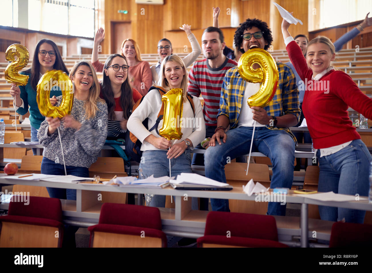 Smiling students having party on university celebrating holiday Stock ...