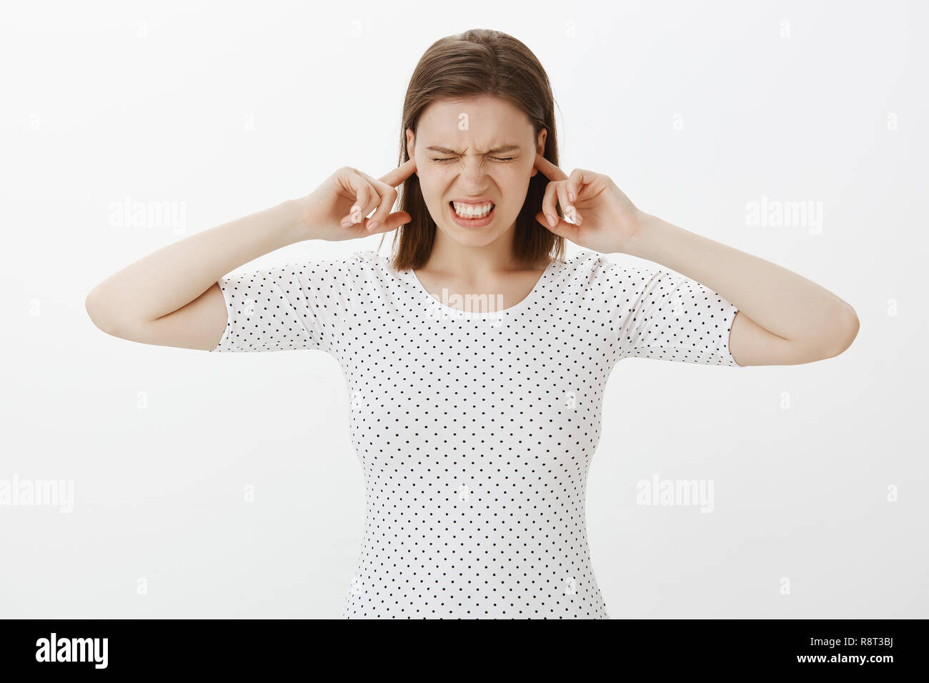Parents fighting again, girl frowning and grimacing, clenching teeth ...