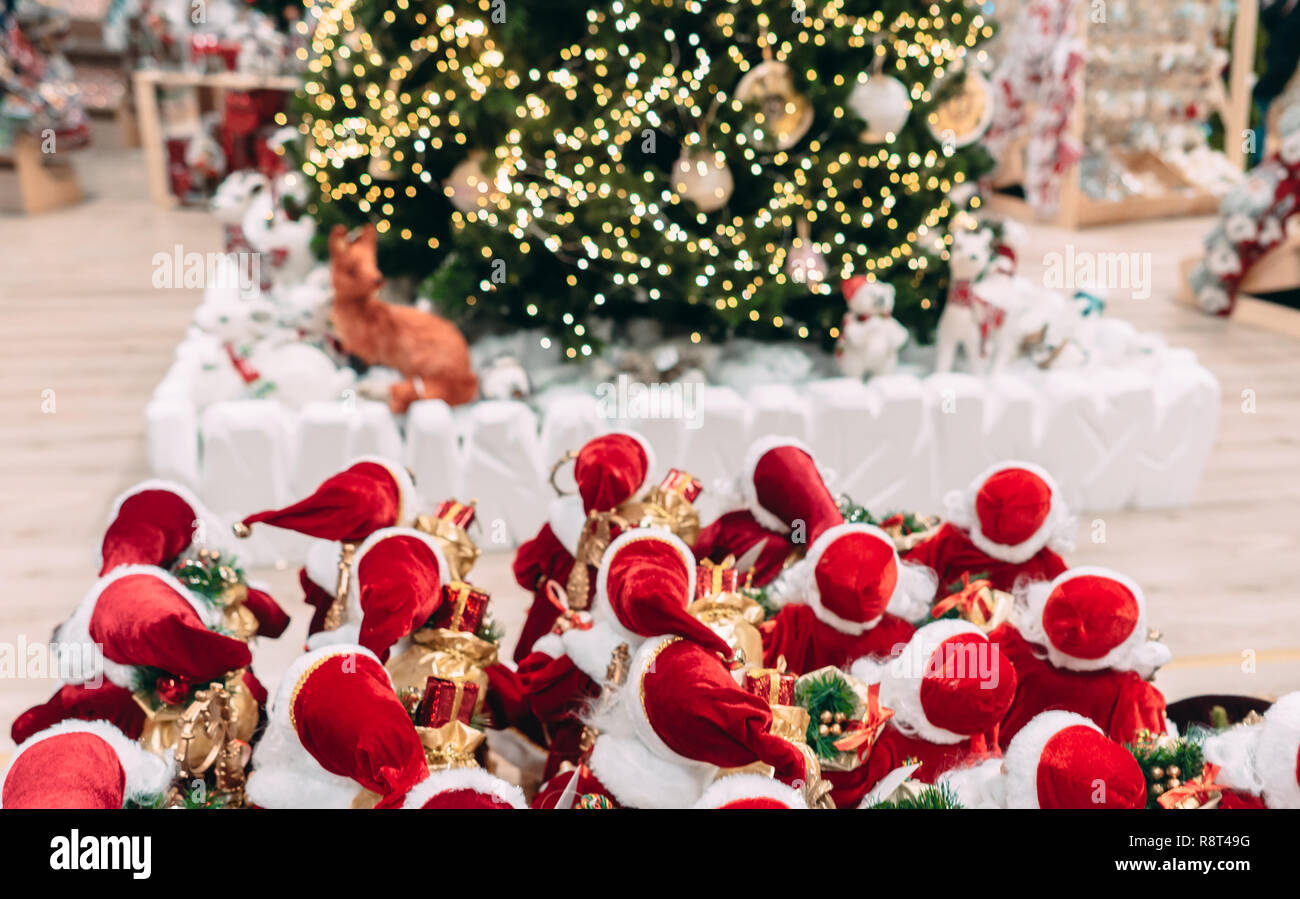 Several small toy Santa Clauses stand in a group Stock Photo - Alamy