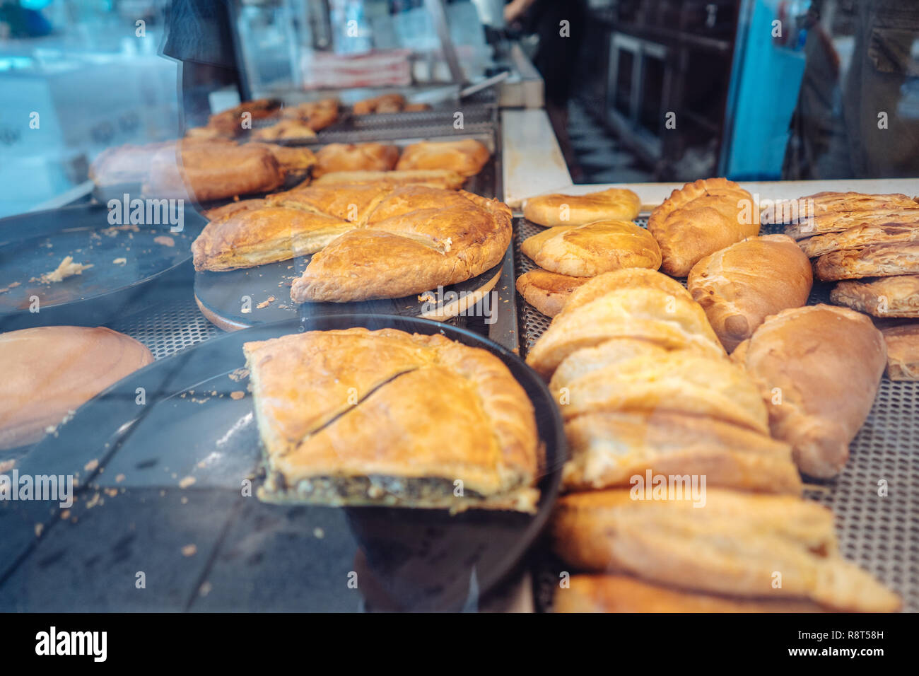 Fresh bakery in showcase of a street shop bakery food Stock Photo - Alamy