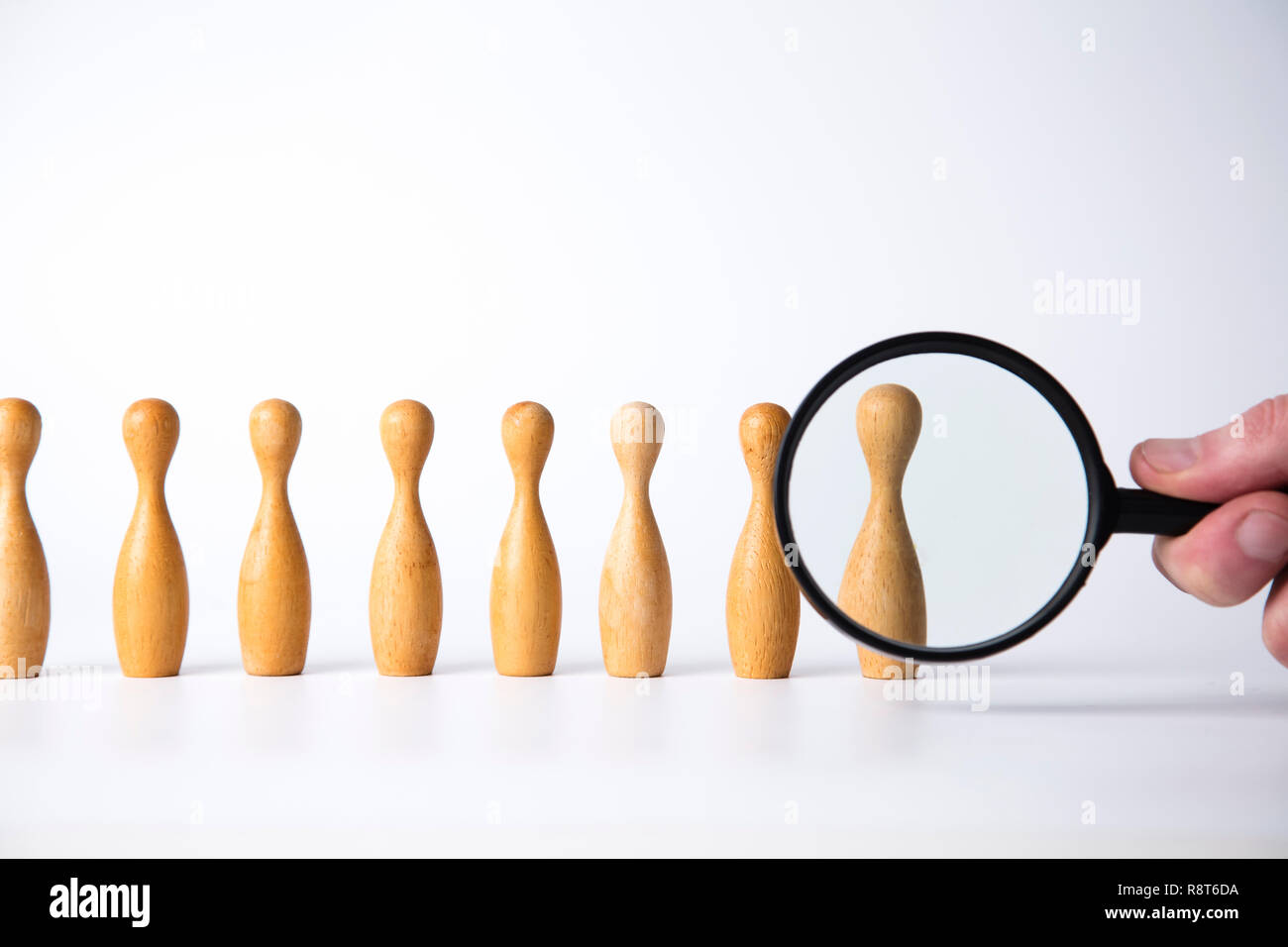 Recruitment concept. Magnifying glass with wooden people. Talent, Job ...