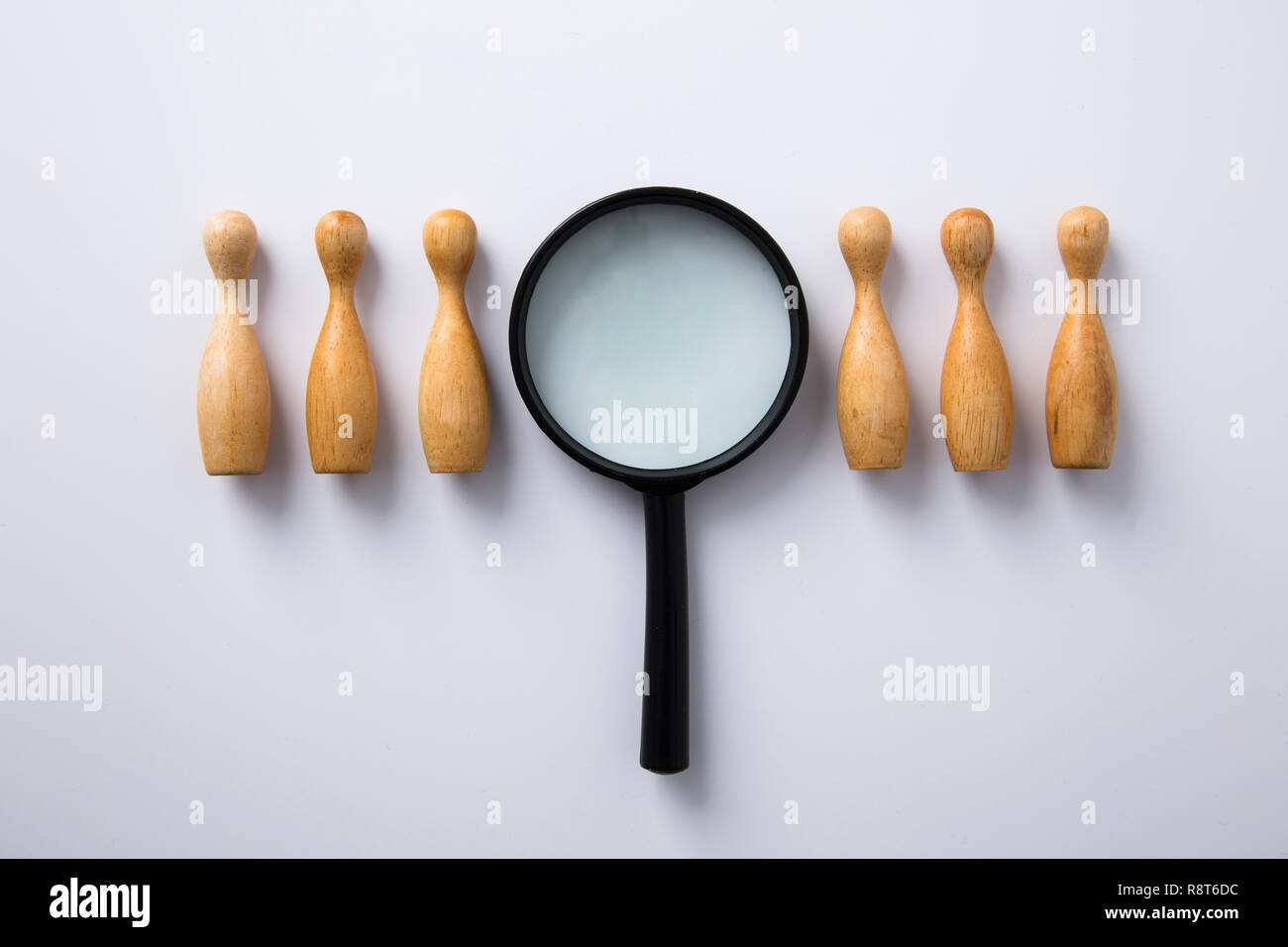 Recruitment concept. Magnifying glass with wooden people. Talent, Job ...