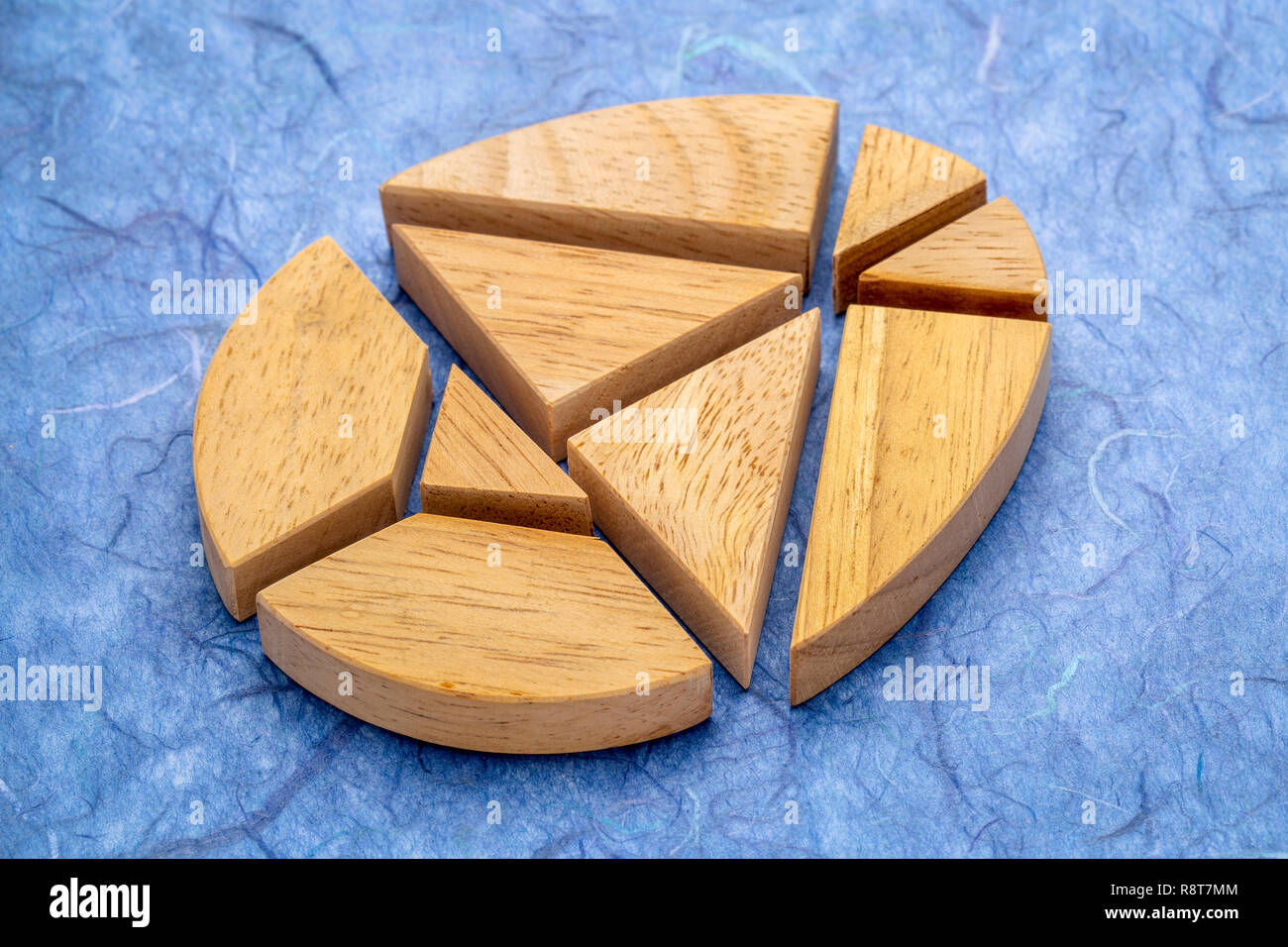 egg version of tangram, ancient Chinese puzzle - wooden pieces on a ...