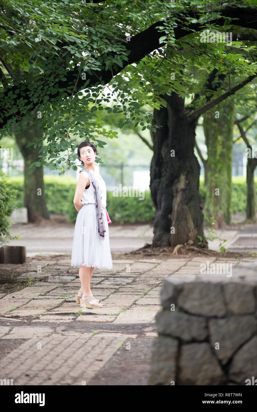 Asian female model poses for pictures in the cityscape Stock Photo - Alamy
