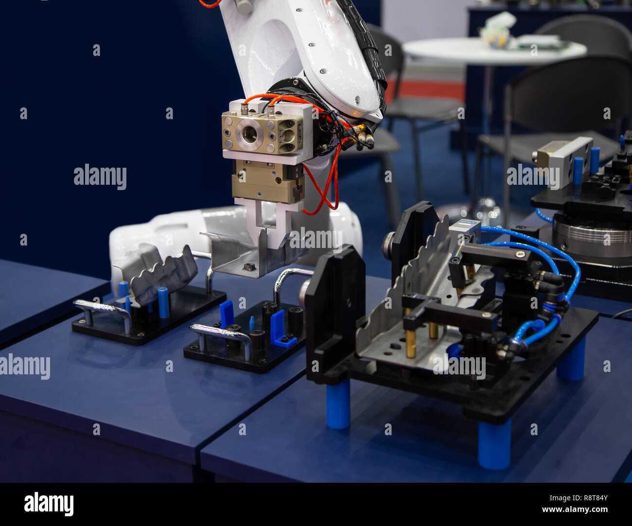 Industry automated robot arm loading and unloading workpieces in ...