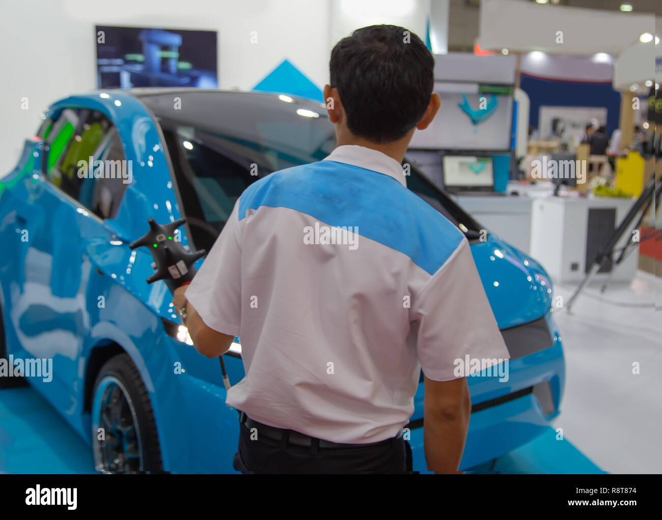 Worker perform handheld 3D scan for car quality control of geometries ...