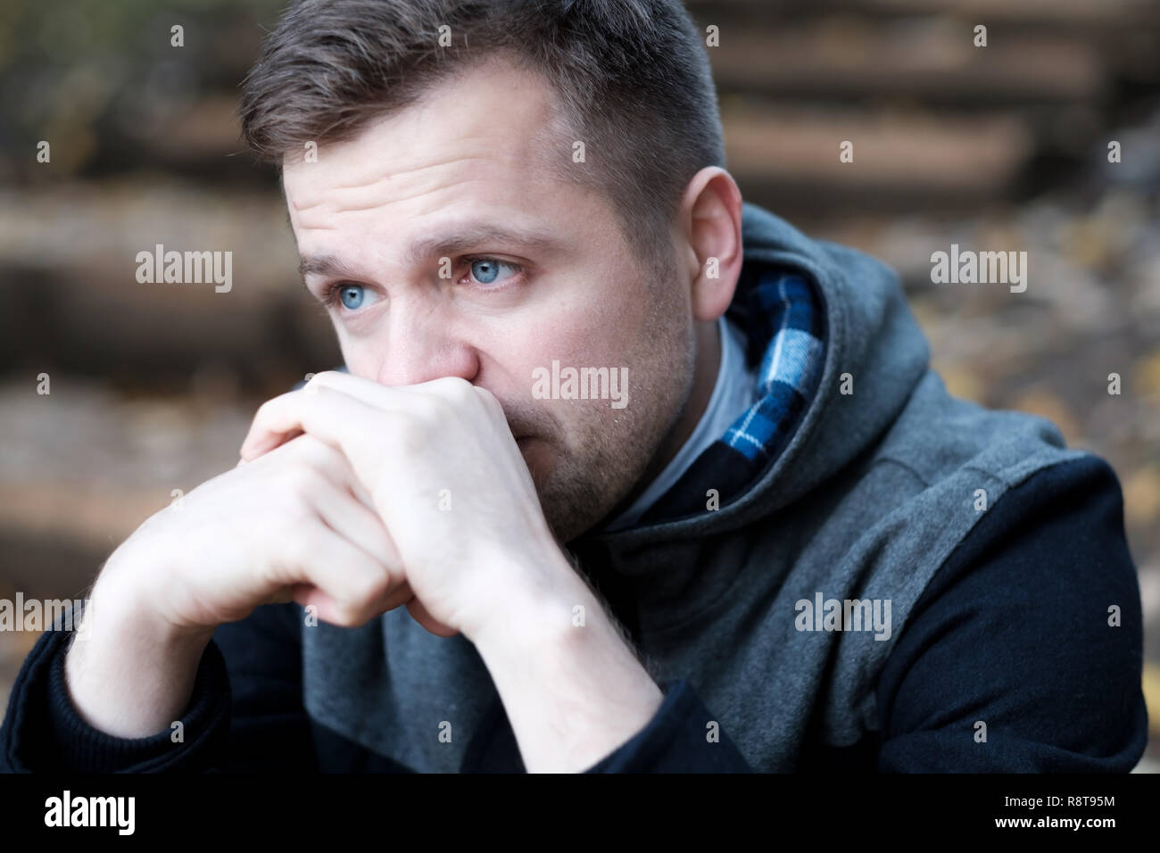 Desperate european man sitting alone on stairs outdoors in autumn. He ...