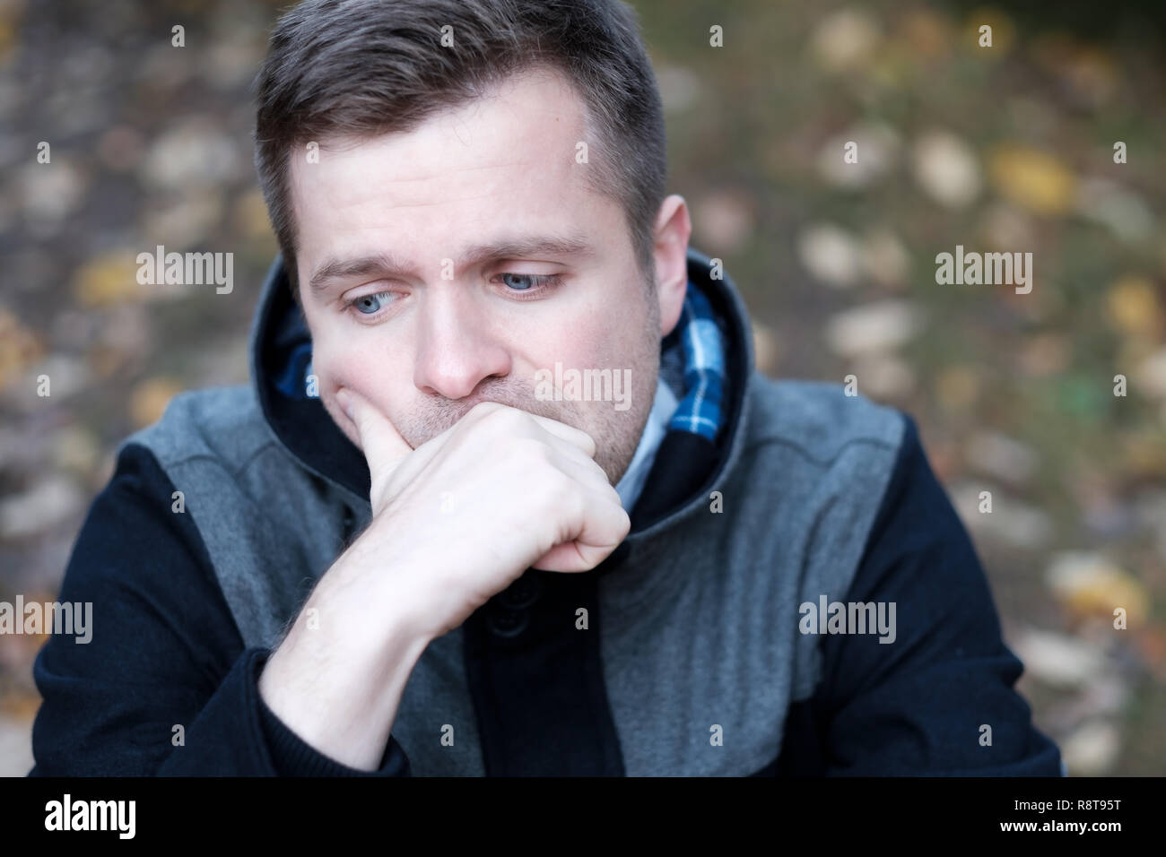 Desperate european man sitting alone on stairs outdoors in autumn. He ...