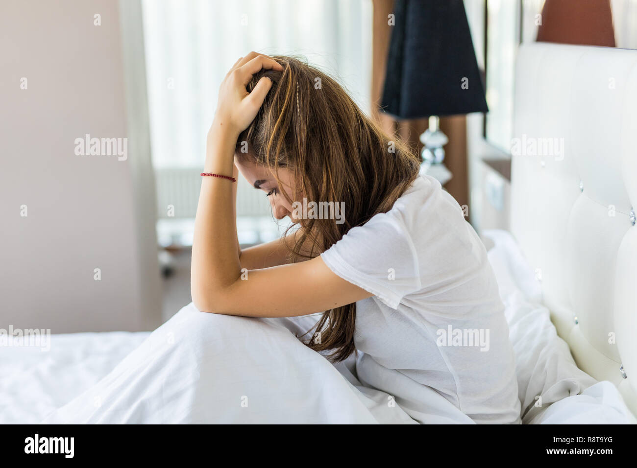 Young woman feel sick and unwell on bed Stock Photo - Alamy