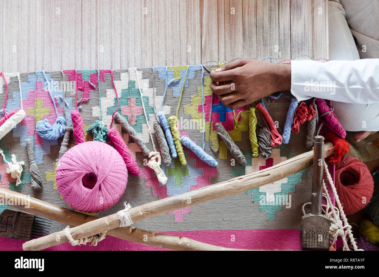 Colorful threads on a loom for traditional Panja dhurrie weaving ...
