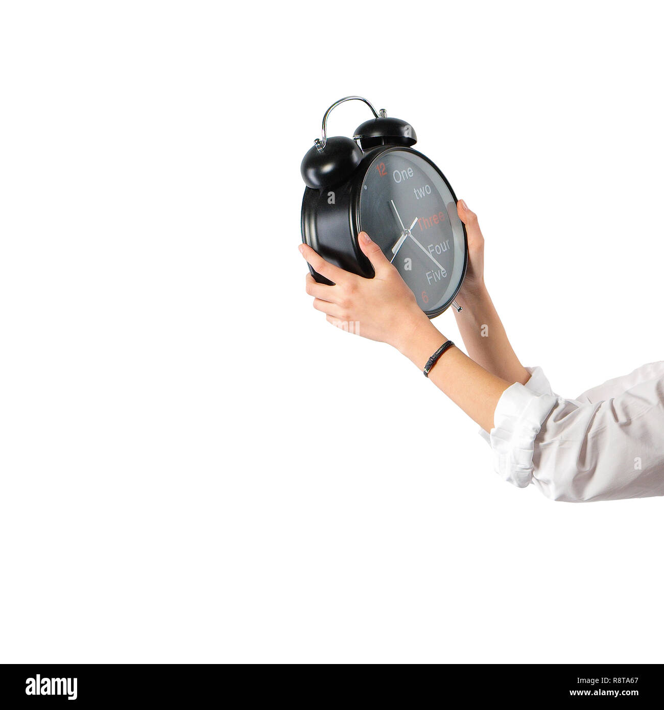 Female hands holding big alarm clock isolated on white Stock Photo - Alamy