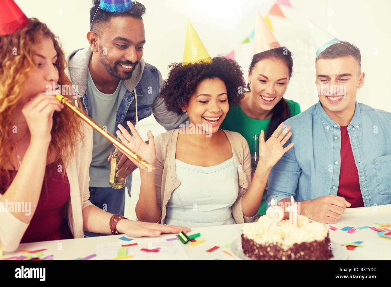team greeting colleague at office birthday party Stock Photo - Alamy