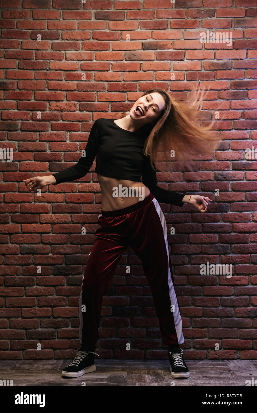 Full length photo of seductive hip hop dancer or sporty girl dancing ...