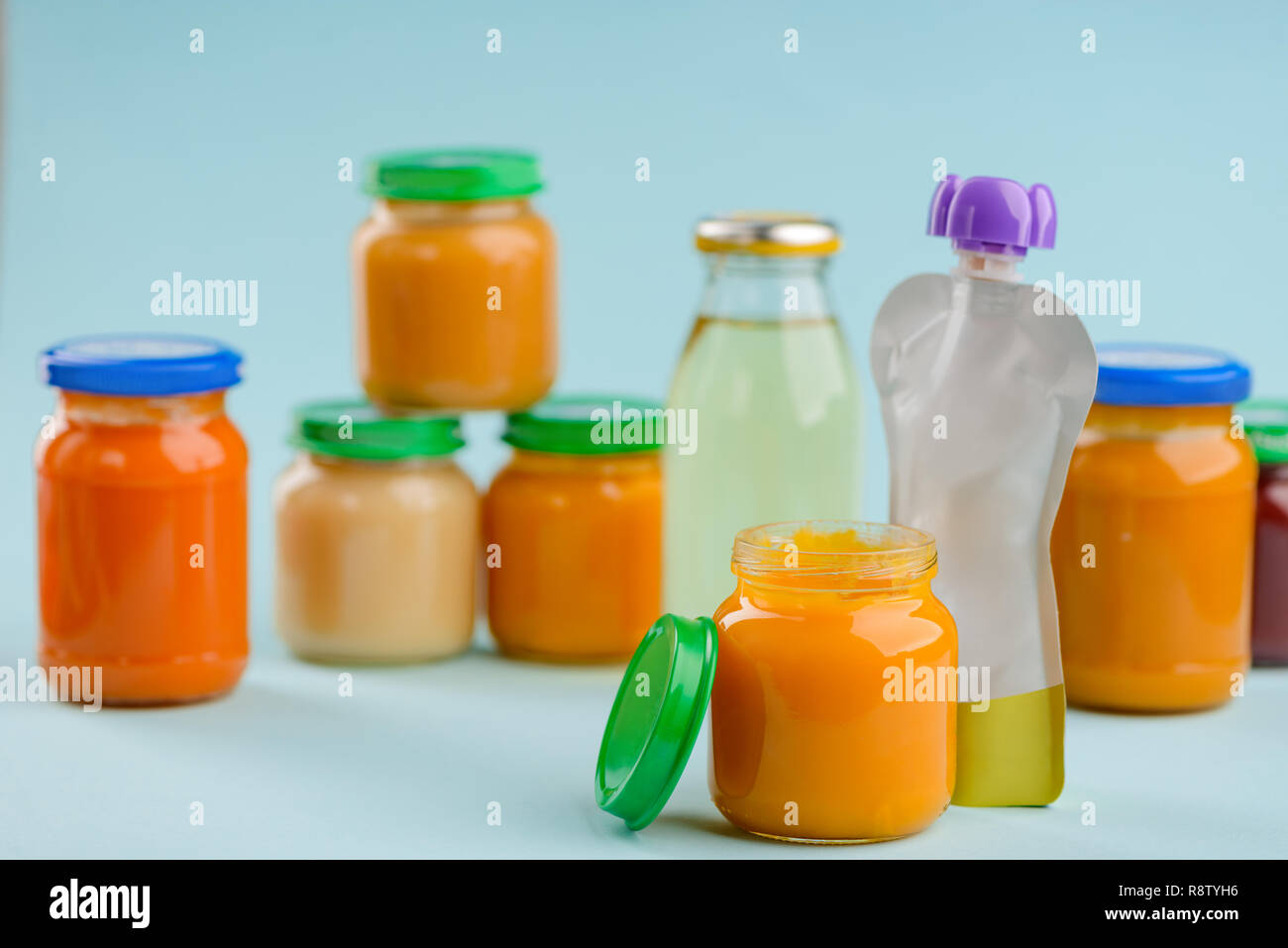 Jars and pouch of puree Stock Photo - Alamy