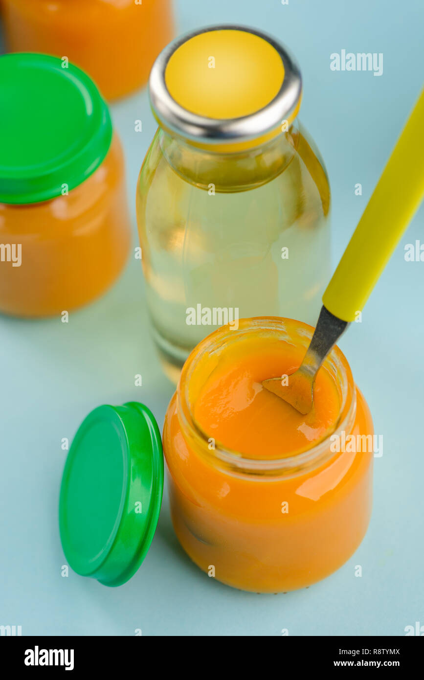 Jar of puree and spoon Stock Photo - Alamy