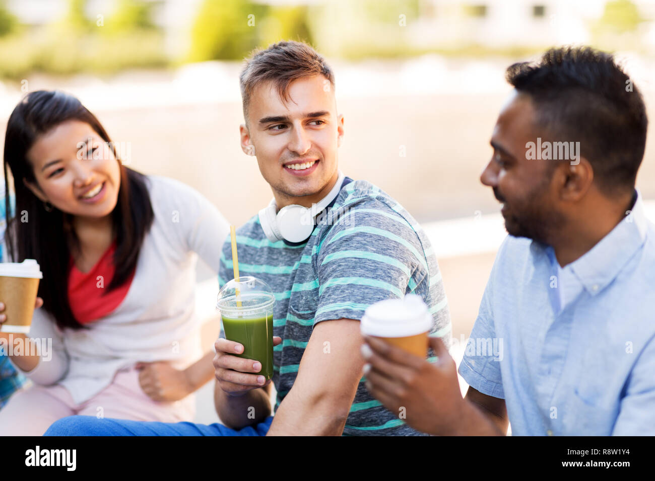 Friends drinking coffee juice talking hi-res stock photography and ...