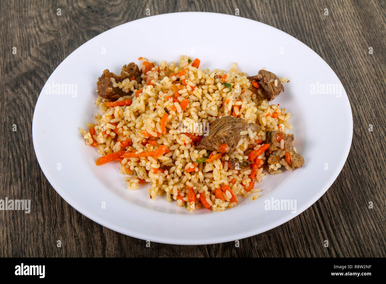 Asian rice - Plov with meat and carrot Stock Photo - Alamy