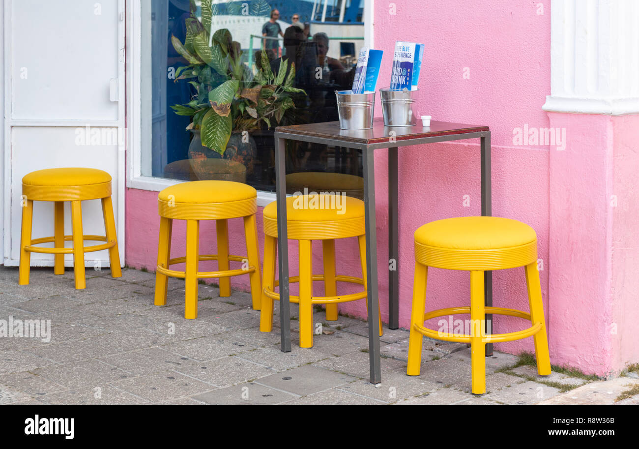 Four bright yellow stools hi-res stock photography and images - Alamy