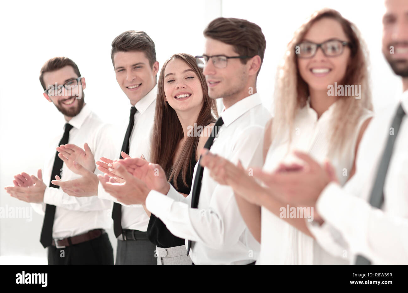 Applauding leadership smiling standing hi-res stock photography and images - Alamy