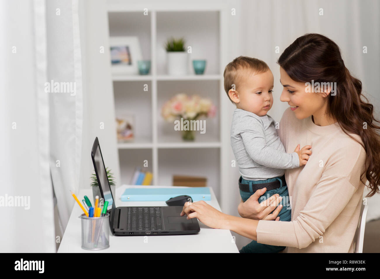 Female mother working home family technology hi-res stock photography ...