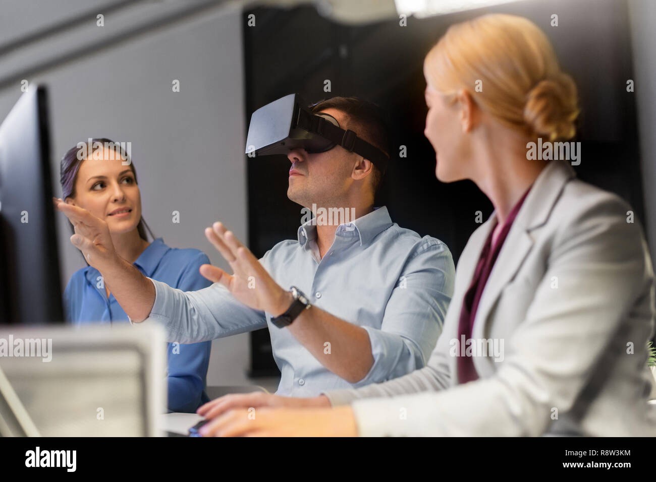 business team with computer working late at office Stock Photo - Alamy