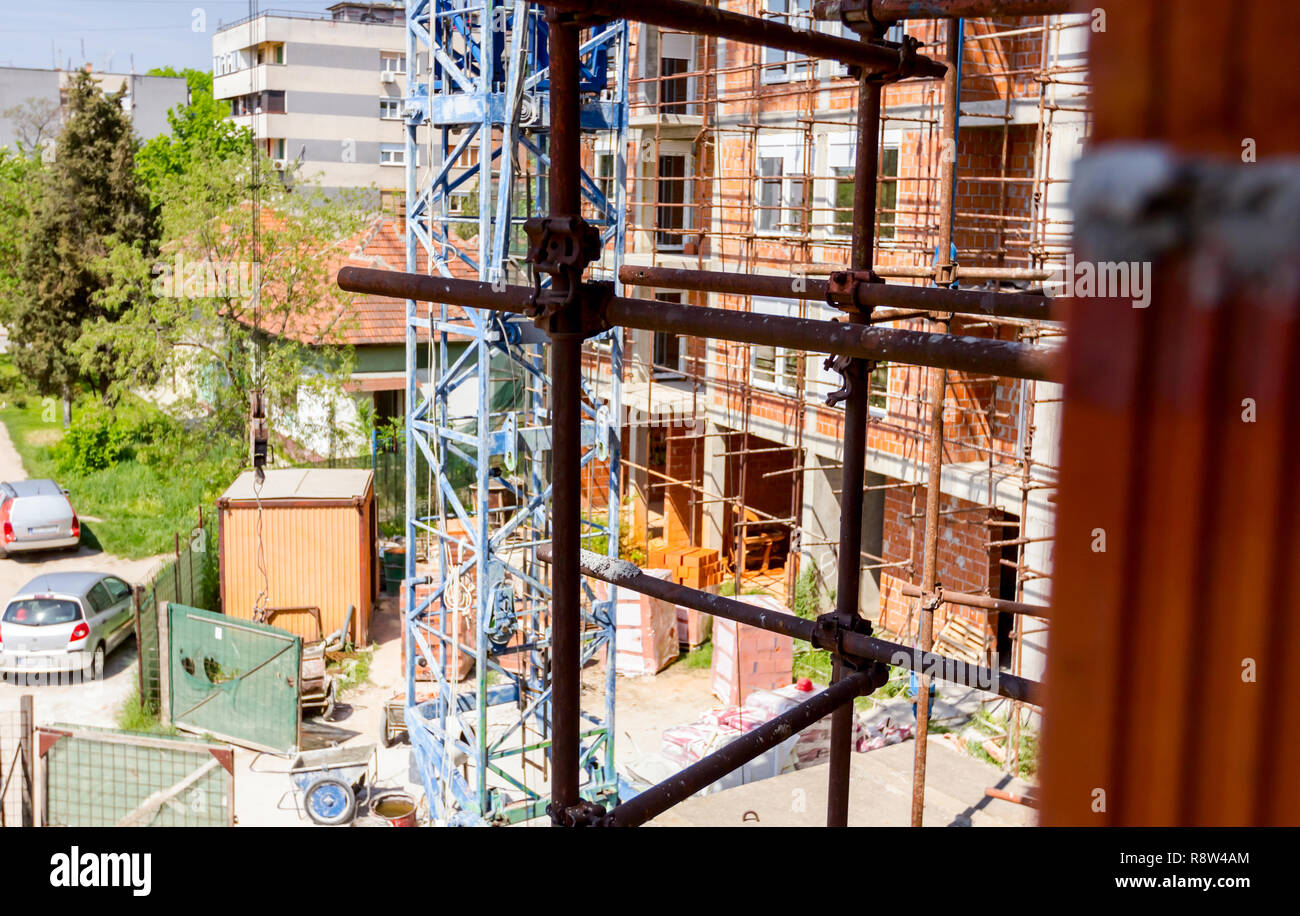 Scaffold is placed against edifice, building under construction Stock ...