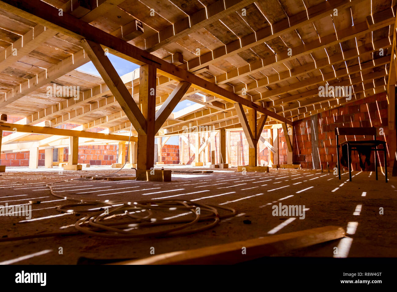 New attic is under construction, unfinished with roofing wooden truss ...