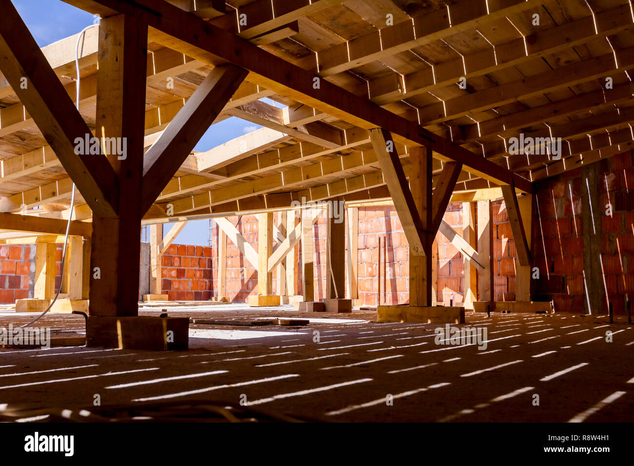 New attic is under construction, unfinished with roofing wooden truss ...