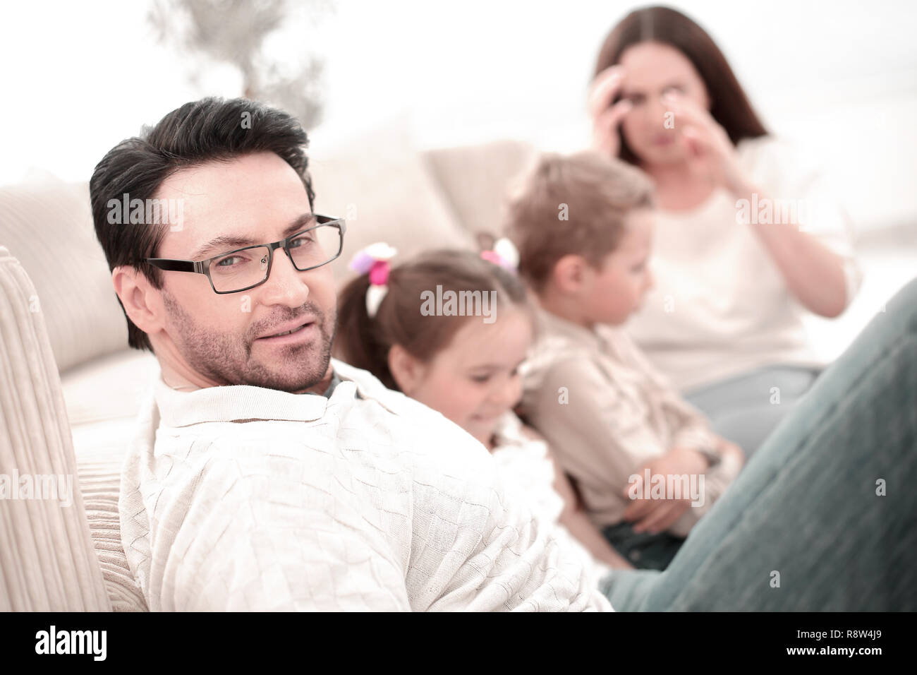 close up.parents play with their children sitting on the couch Stock ...