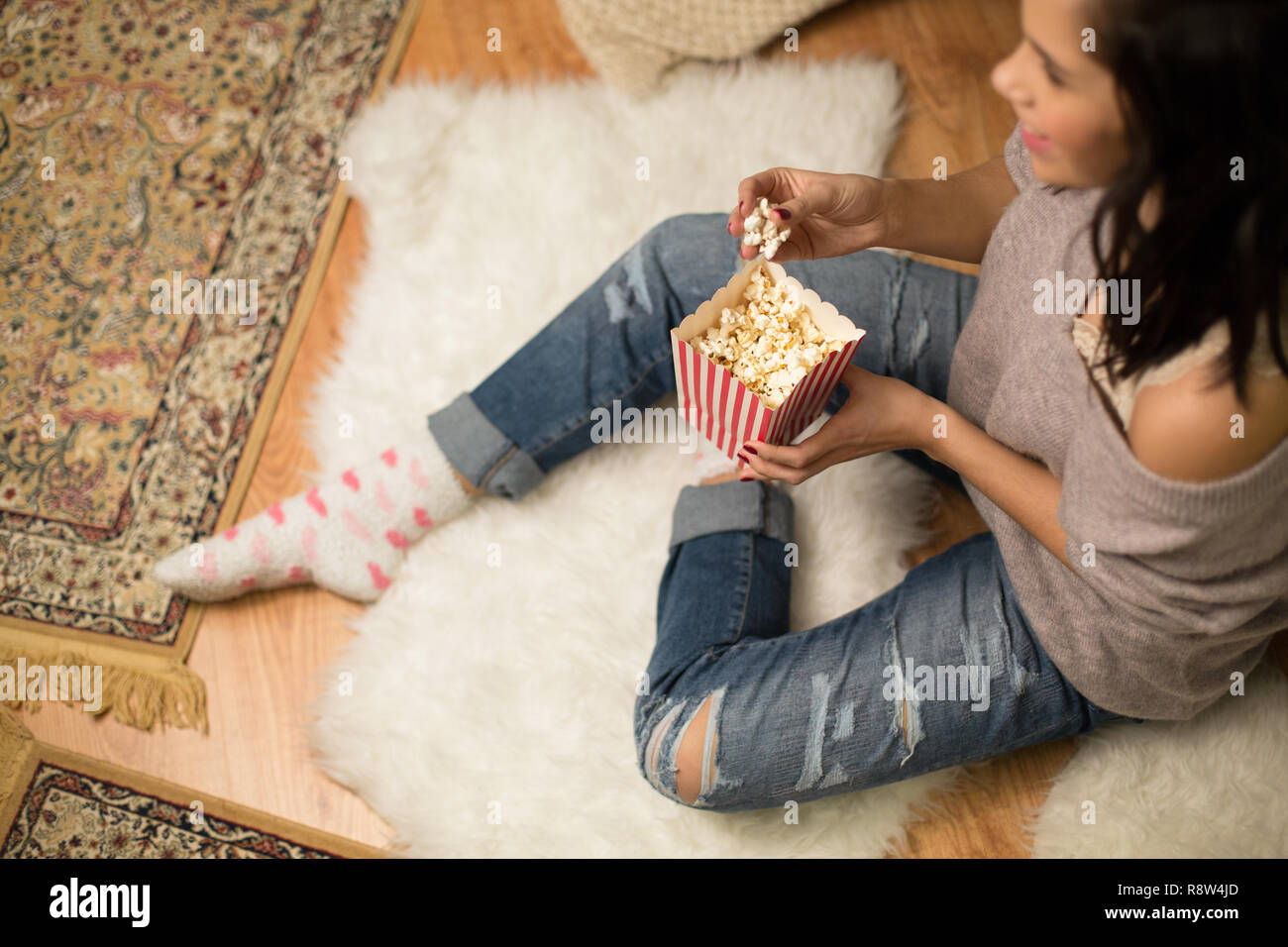 happy woman eating popcorn at home Stock Photo - Alamy