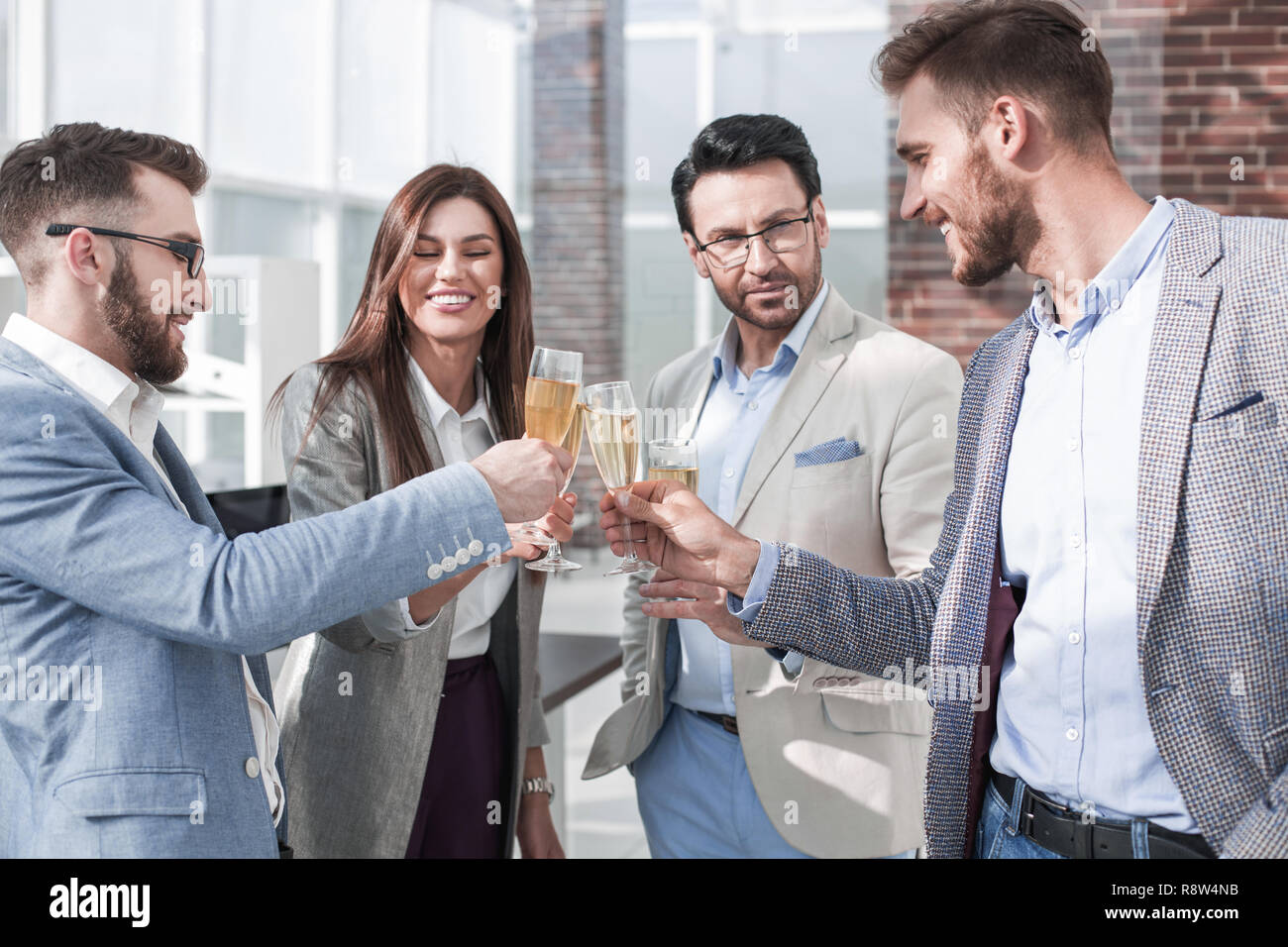 close up.business team raises their glasses Stock Photo - Alamy