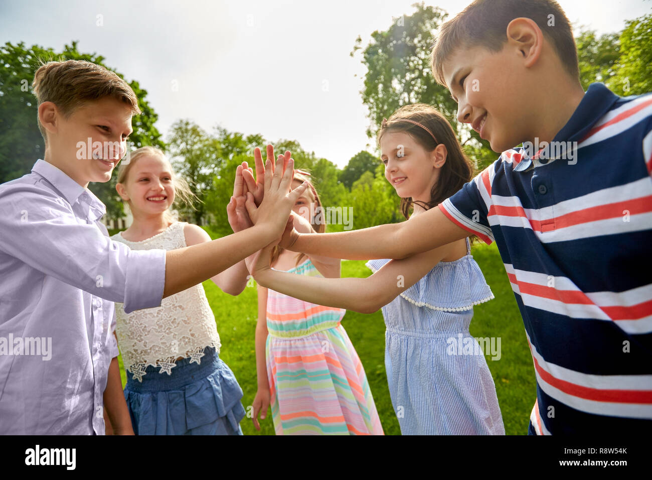 Group Of Kids High Five