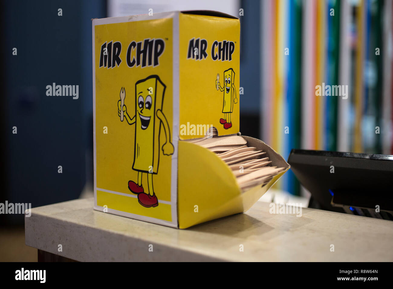 Mr Chip wooden fish and chip forks on the counter at a London chips ...