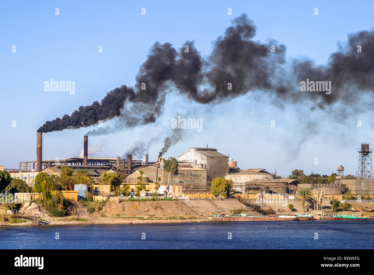 Smoking refinery chimneys hi-res stock photography and images - Alamy