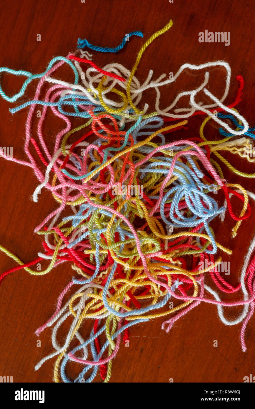 Red and white coloured threads hi-res stock photography and images - Alamy